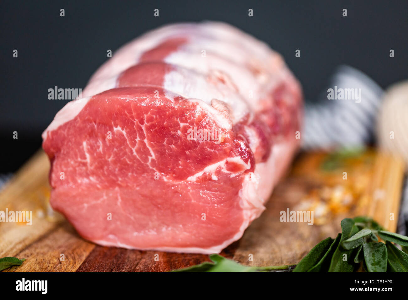 Uncooked boneless pork roast on the cutting board Stock Photo - Alamy