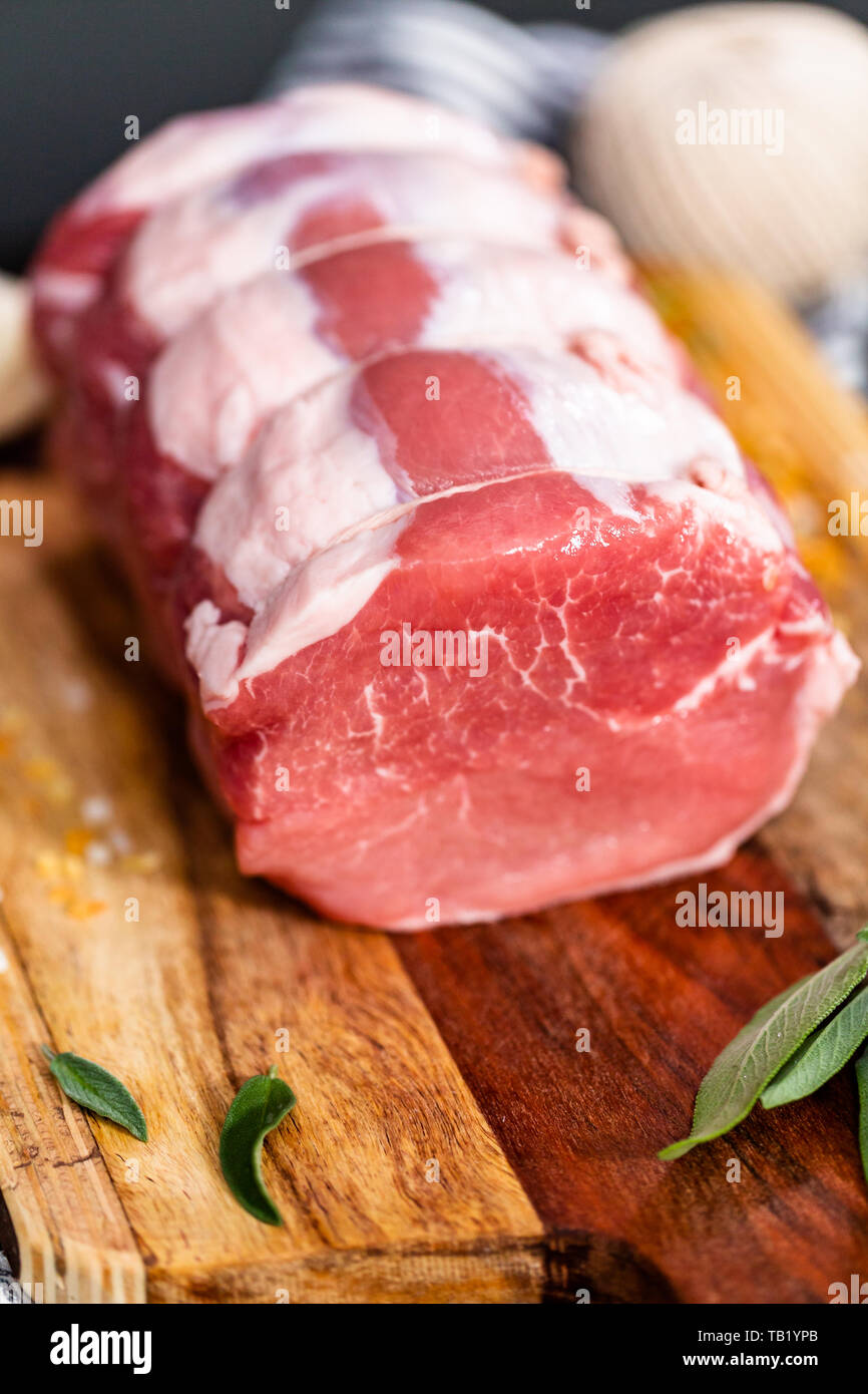 Uncooked boneless pork roast on the cutting board Stock Photo - Alamy