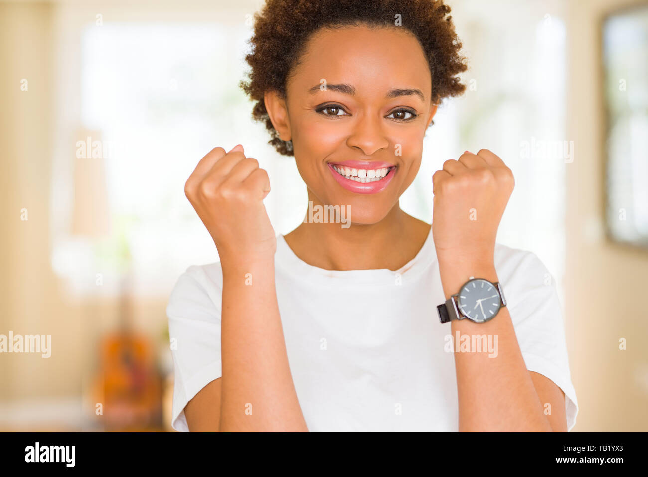 Young beautiful african american woman wearing casual white t-shirt ...