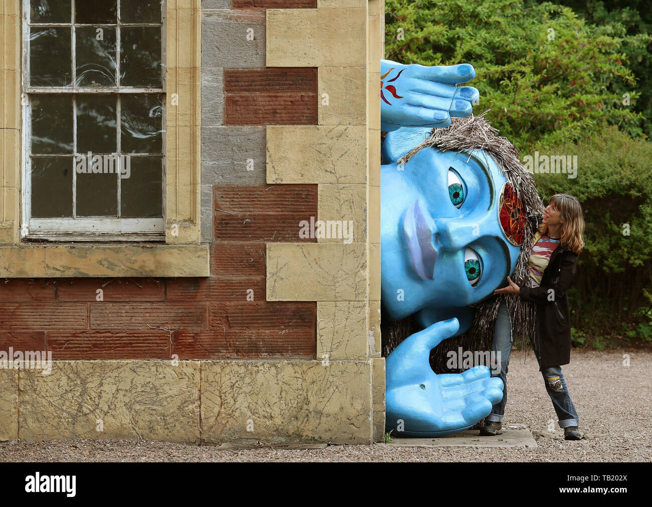 Kim Bergsaget with the UK's largest puppet, Big Man Walking as she trys ...