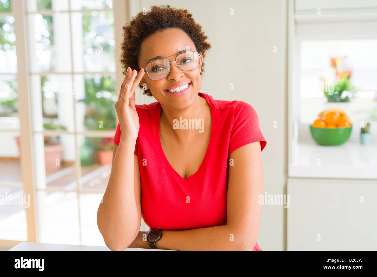 Beautiful young african woman with afro hair wearing glasses Stock ...