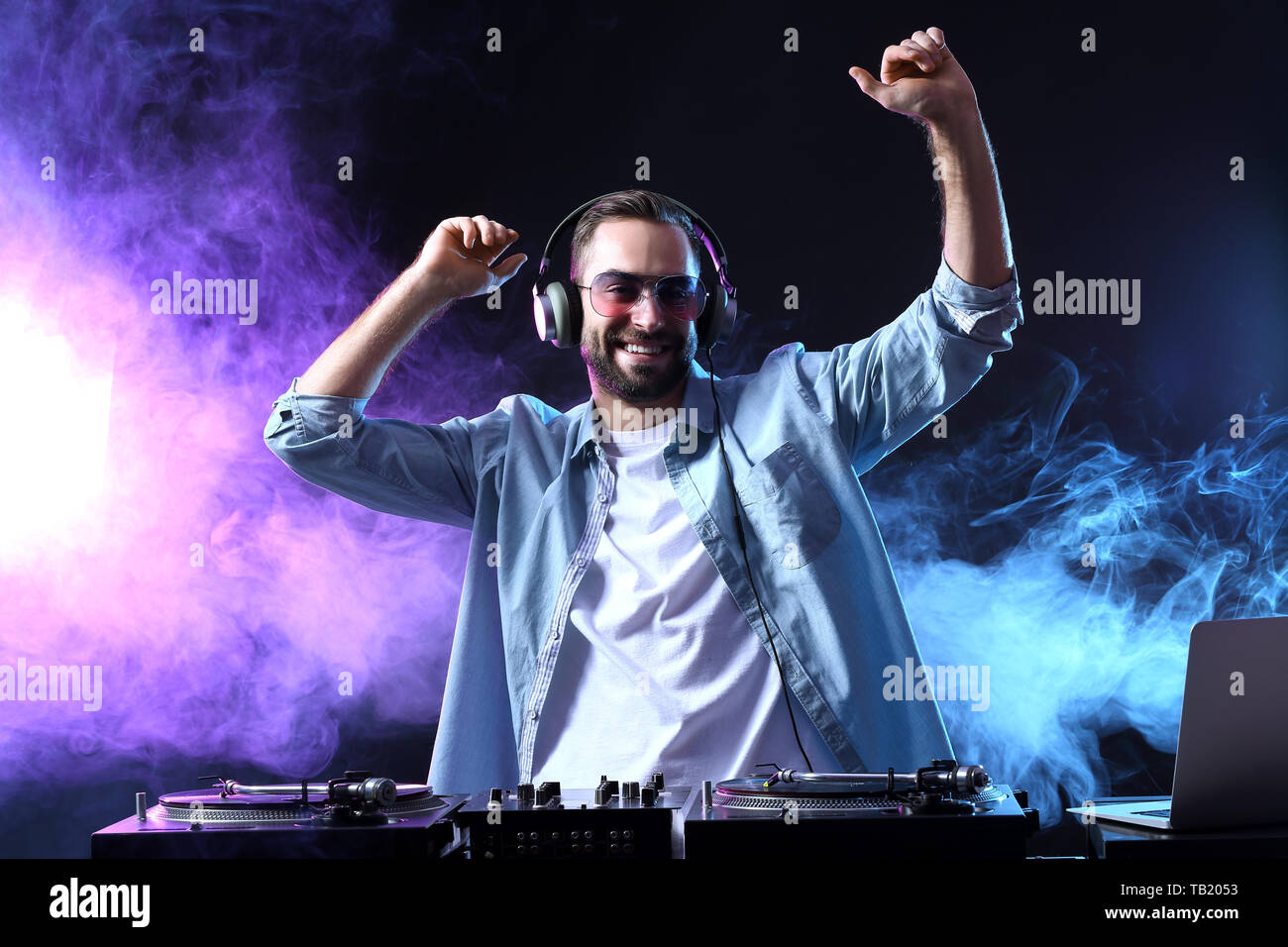 Male DJ playing music in club Stock Photo - Alamy