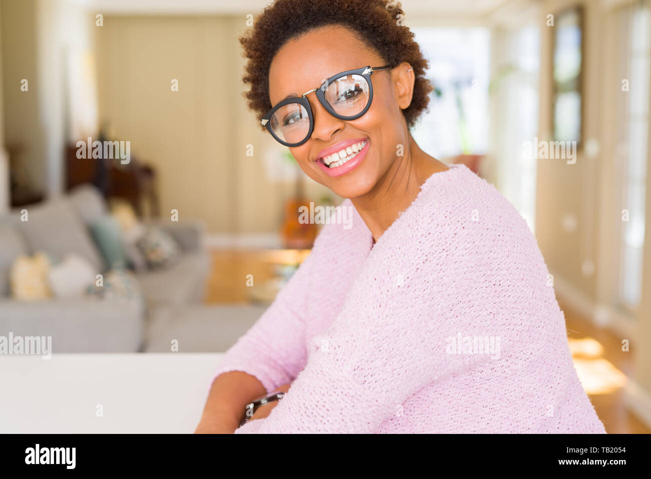 Beautiful young african woman with afro hair wearing glasses Stock ...