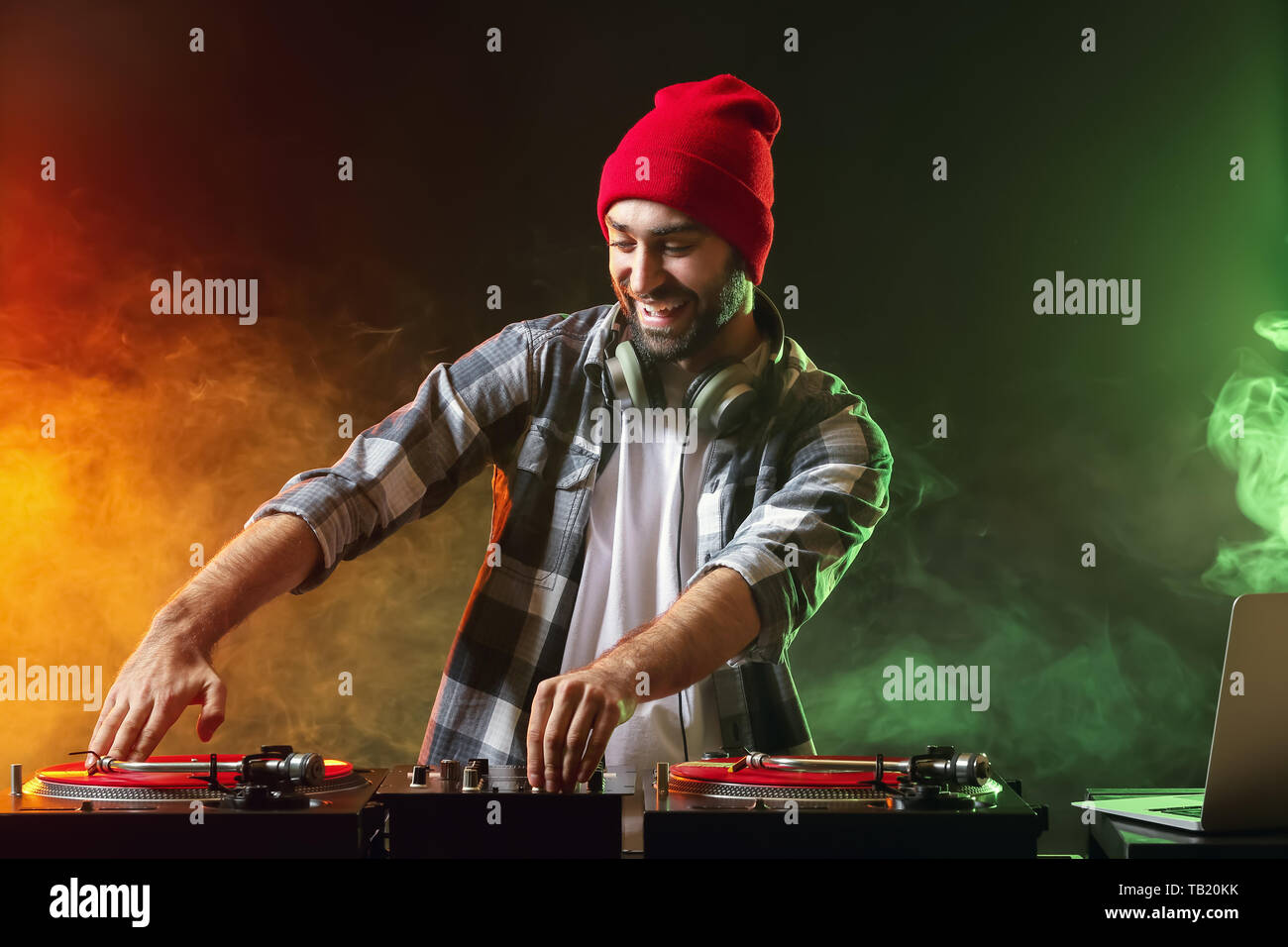 Male DJ playing music in club Stock Photo - Alamy