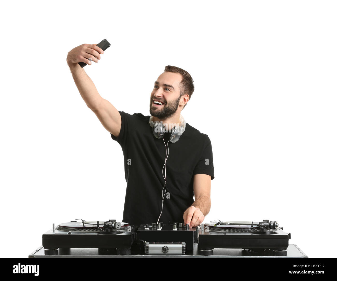 Male DJ taking selfie on white background Stock Photo - Alamy
