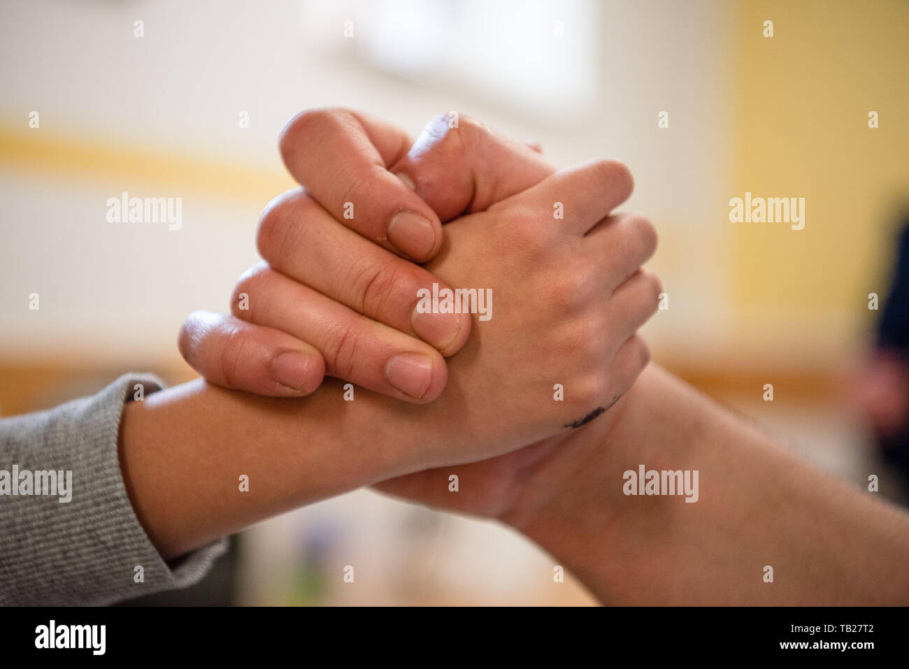 Nuremberg, Germany. 14th May, 2019. An inmate holds the hand of his son ...