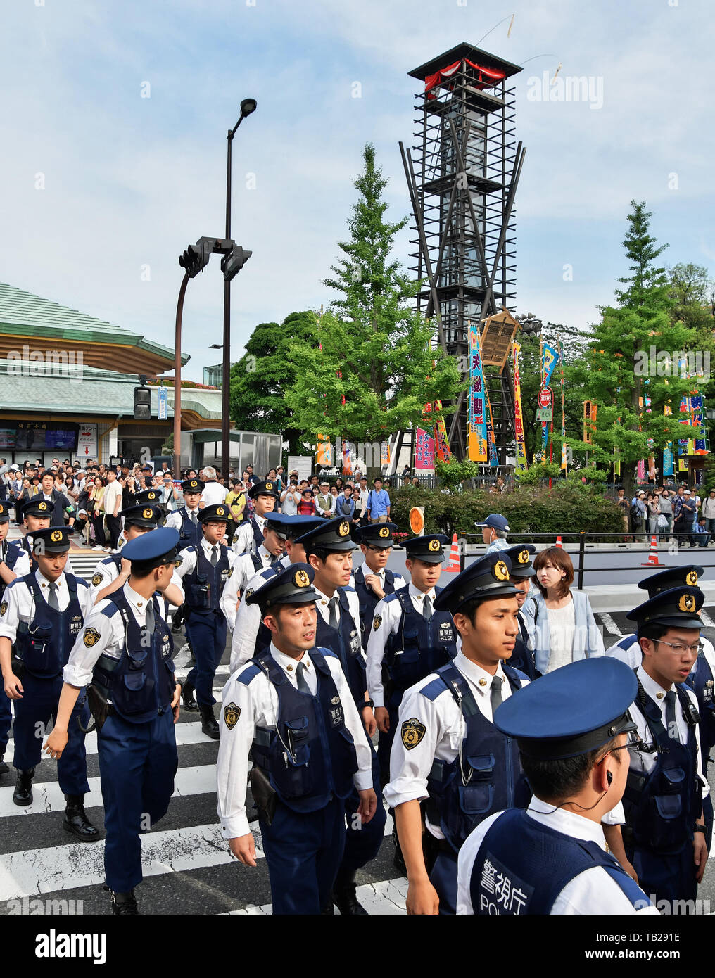 Tokyo metropolitan police officers stand guard around the Ryogoku ...