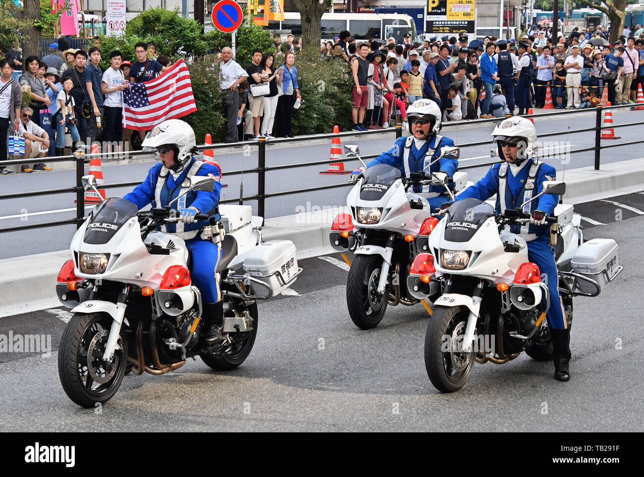 Tokyo metropolitan police officers patrol around the Ryogoku Kokugikan ...