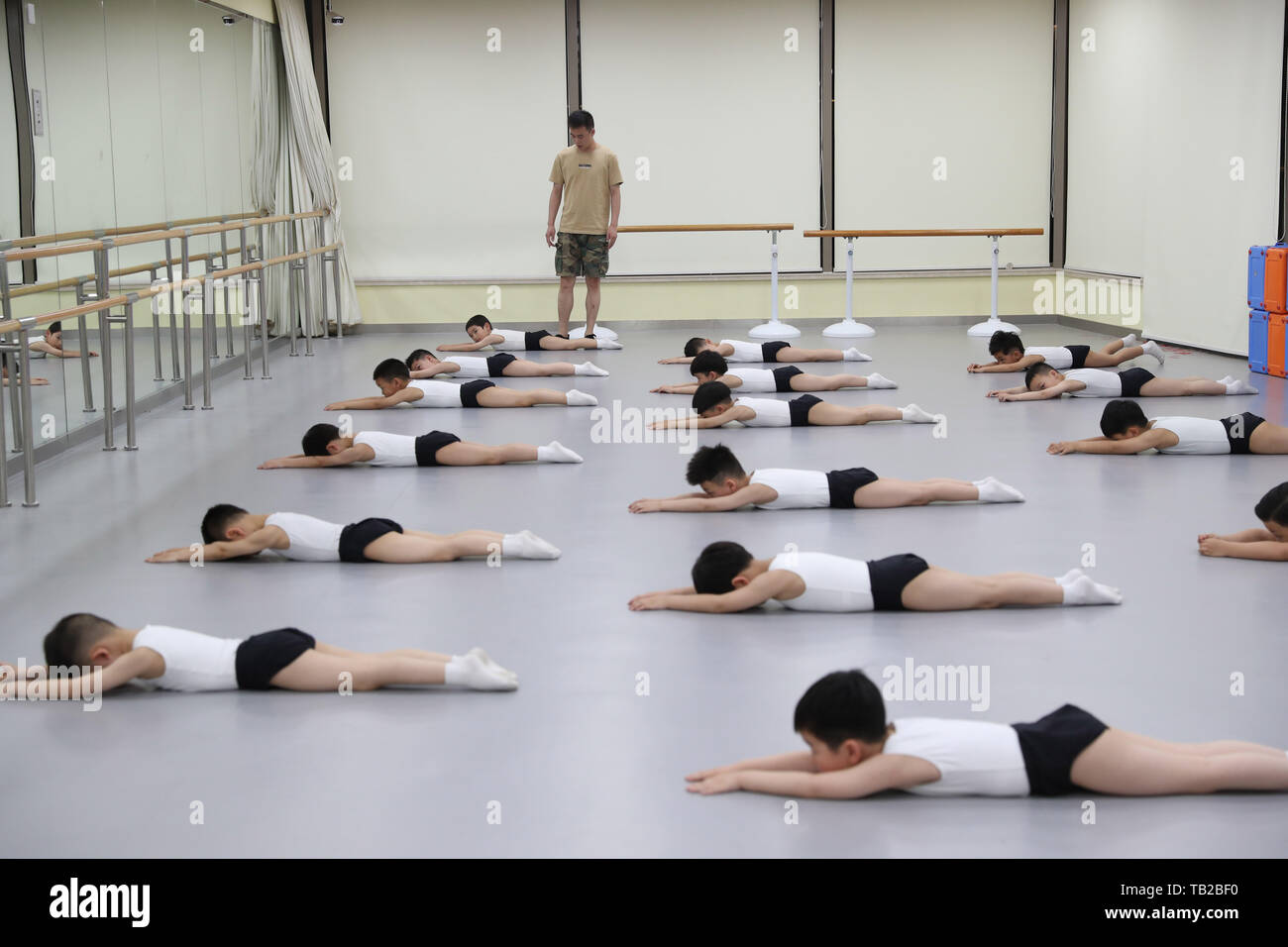 Shanghai, China. 22nd May, 2019. Boy ballet dancers have a class at the ...