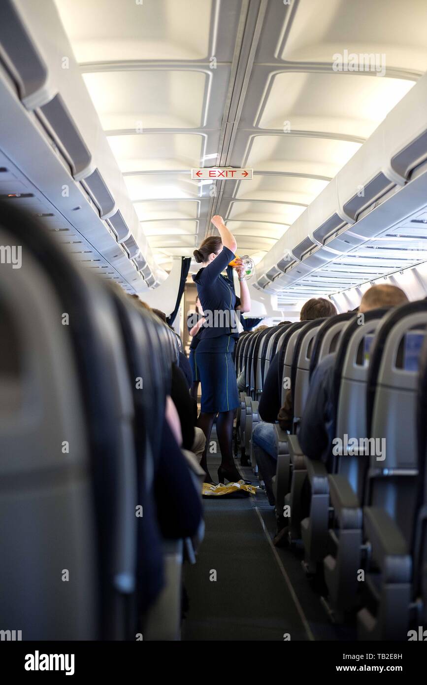 Riga, Latvia - April 03, 2019: Stewardesses in the cabin of the ...