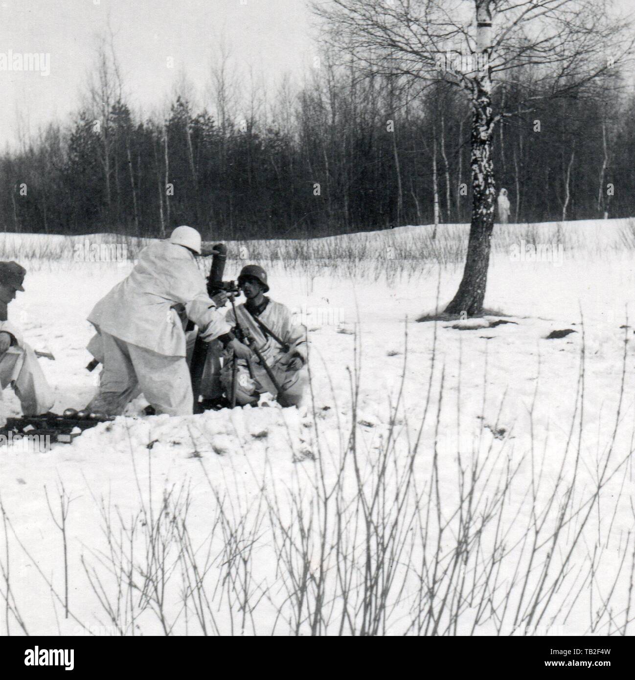 German soldiers fire a mortar in the snow hi-res stock photography and ...