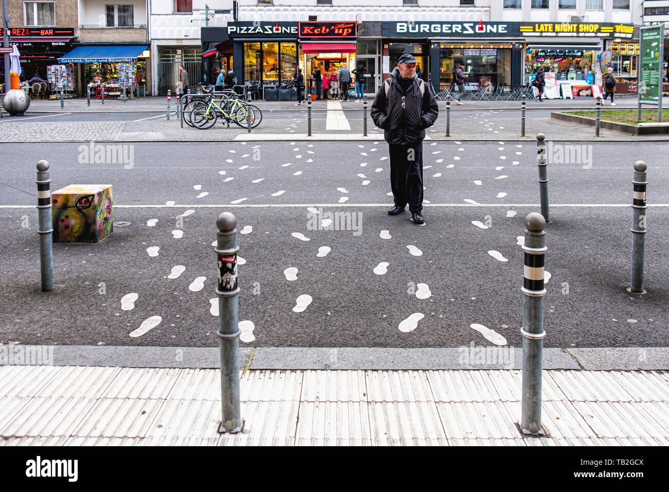 Schöneberg-Berlin. Elderly man crossing pedestrianised area in ...