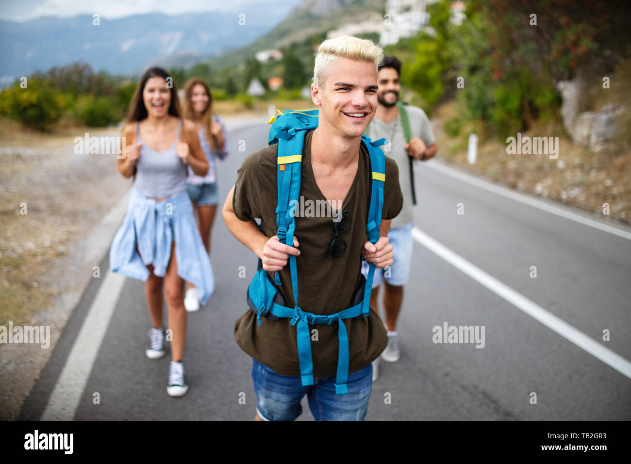 Group of happy friend traveler walking and having fun. Travel lifestyle ...