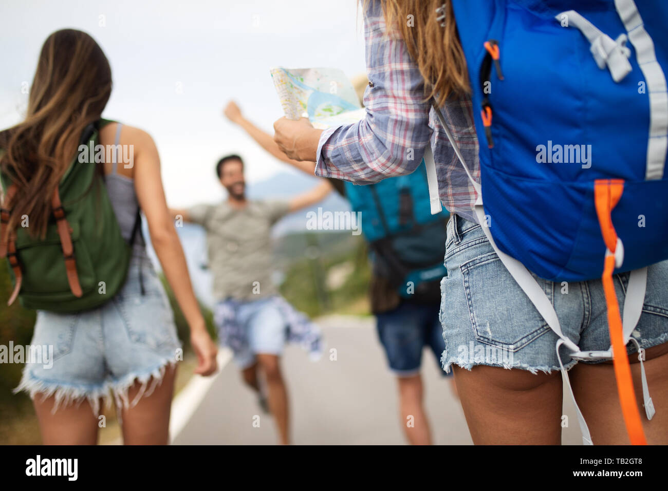 Group of friends backpackers walking and traveling outdoor Stock Photo ...