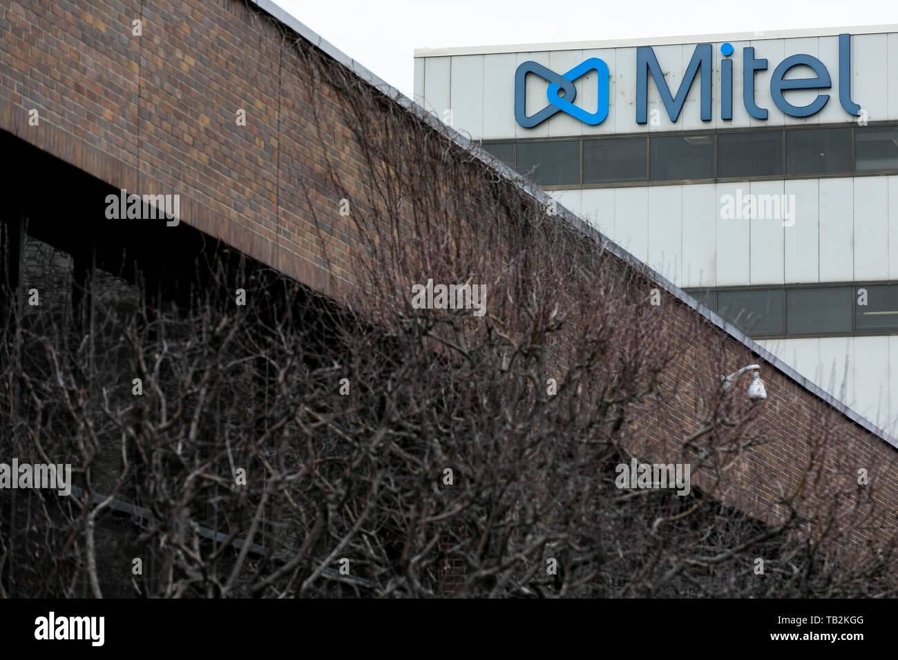 A logo sign outside of the headquarters of the Mitel Networks ...