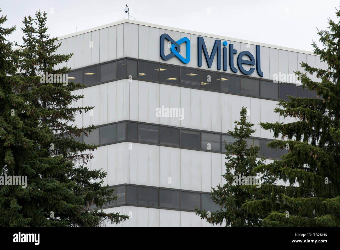 A logo sign outside of the headquarters of the Mitel Networks ...