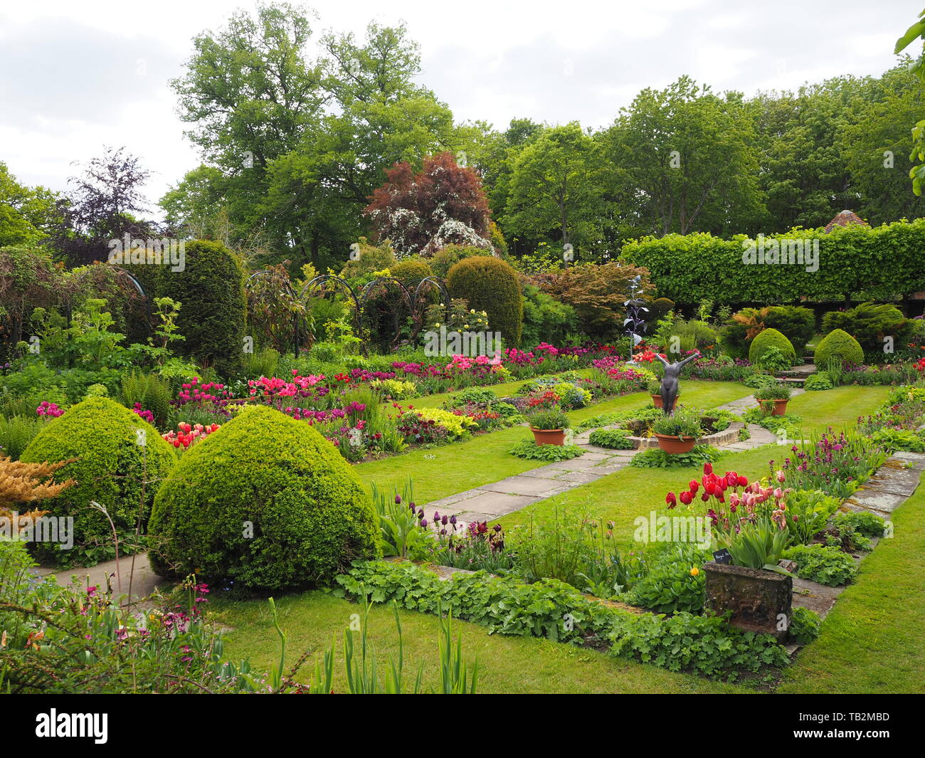 Chenies Manor sunken garden with topiary, path, lawn and ornamental ...