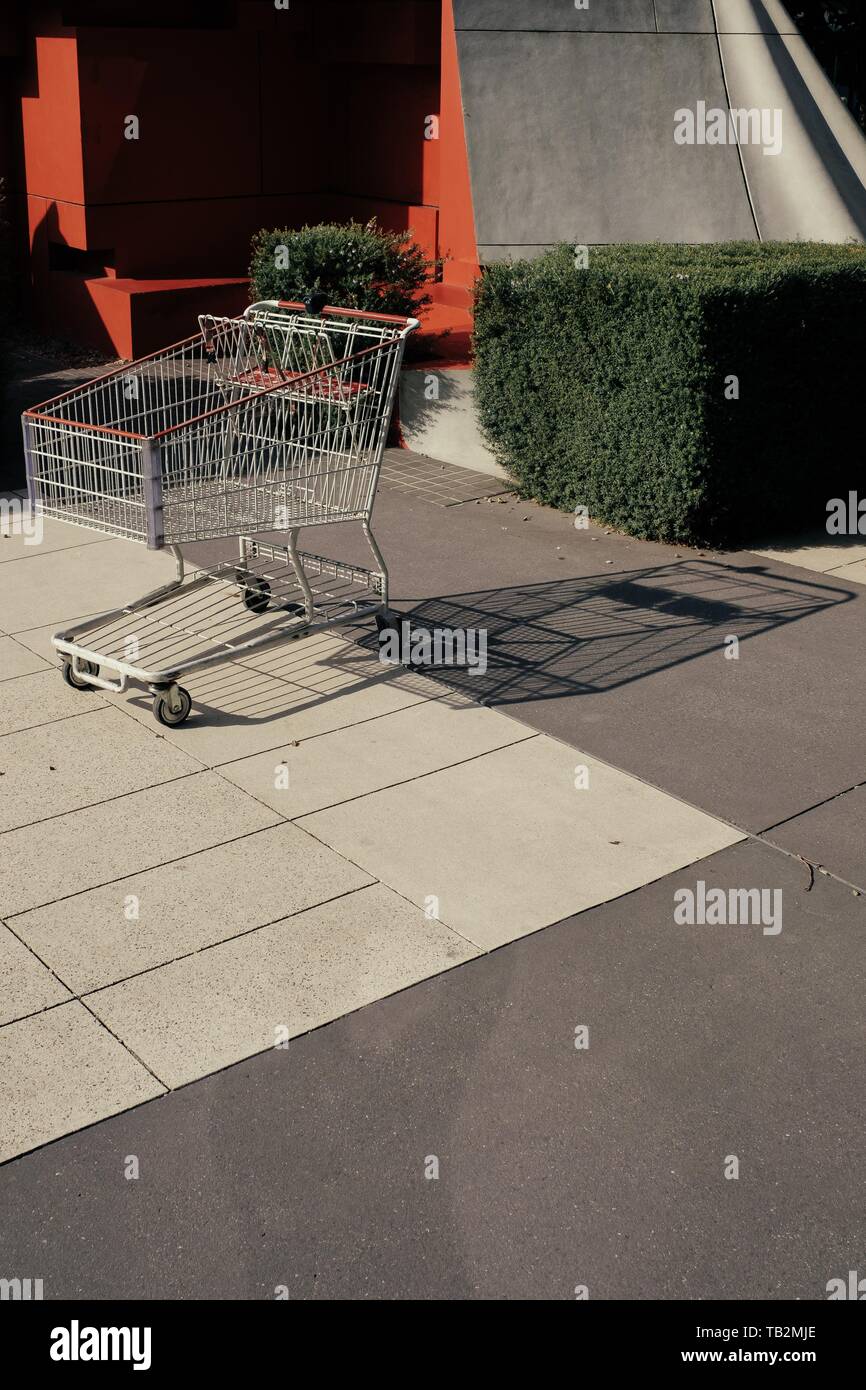 A shopping cart in a random urban area Stock Photo - Alamy