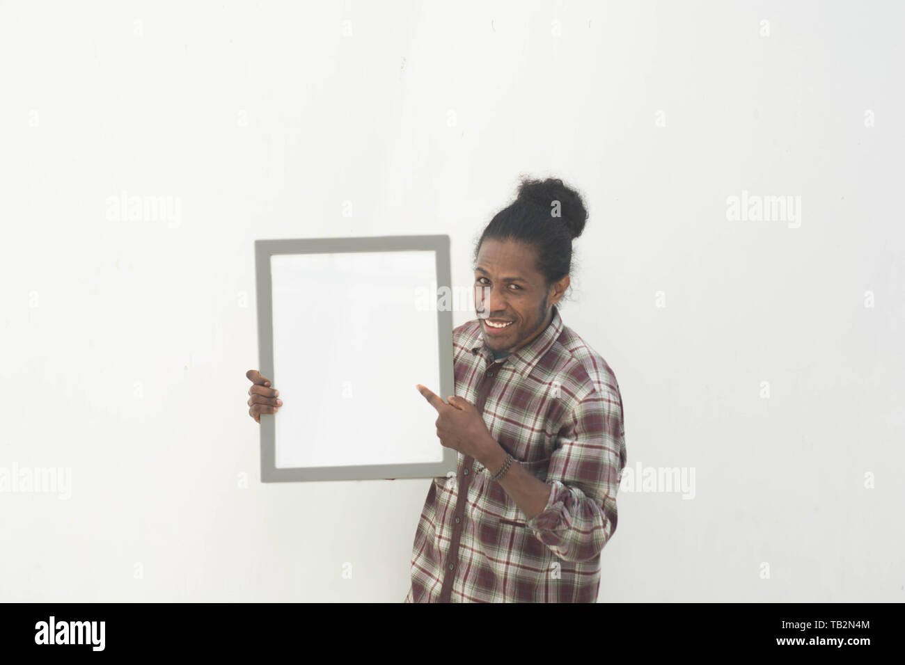 young black man pointing white board with isolated background in white ...