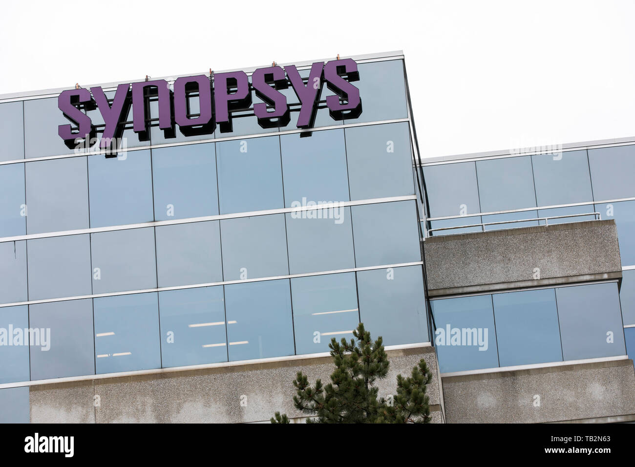 A logo sign outside of a facility occupied by Synopsys in Ottawa ...