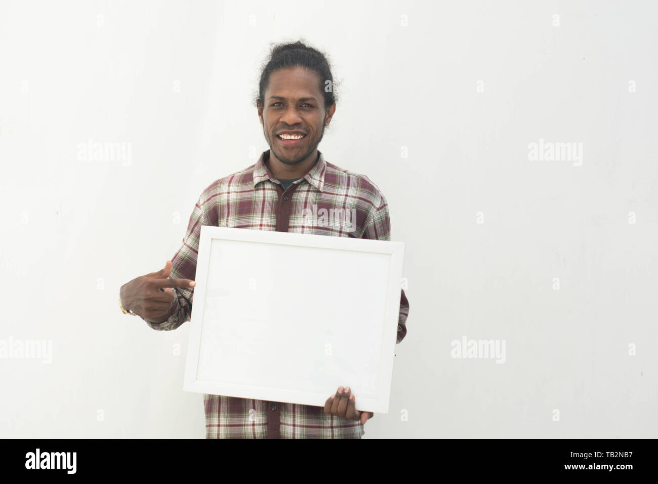 young black man pointing white board with isolated background in white ...