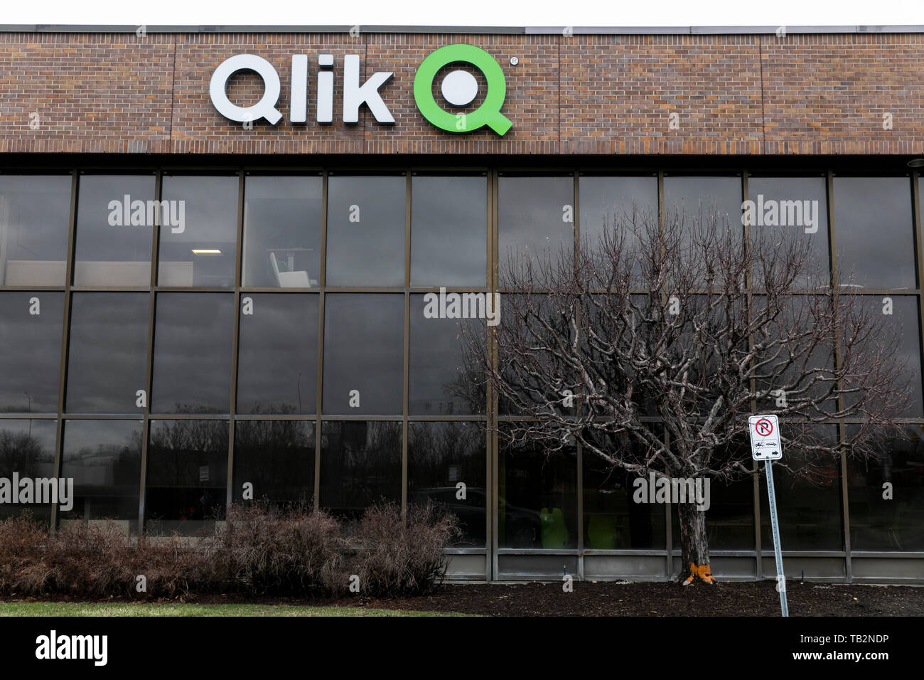 A logo sign outside of a facility occupied by Qlik in Ottawa, Ontario ...