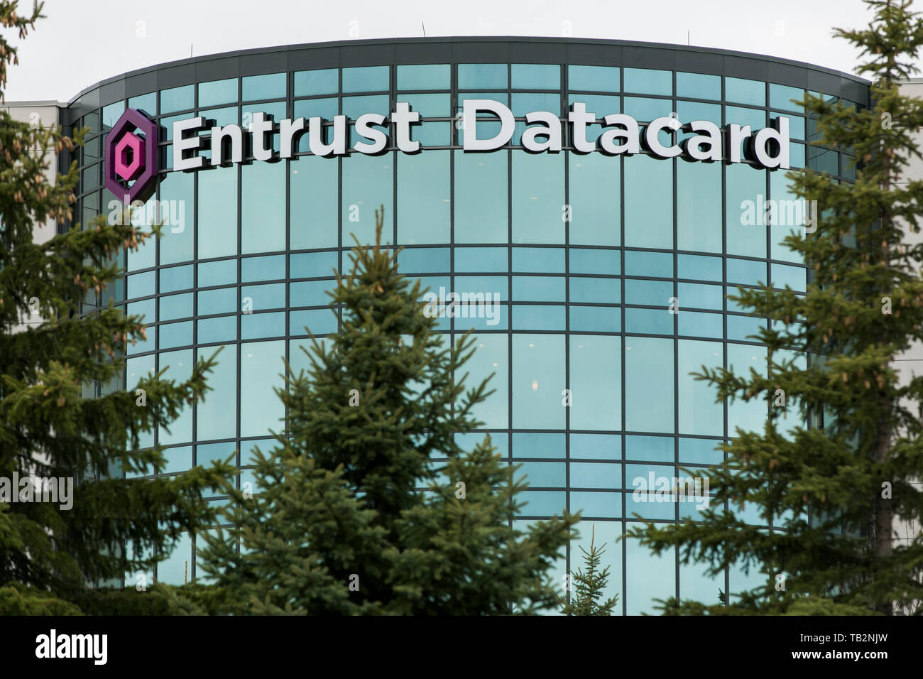 A logo sign outside of a facility occupied by Entrust Datacard in ...