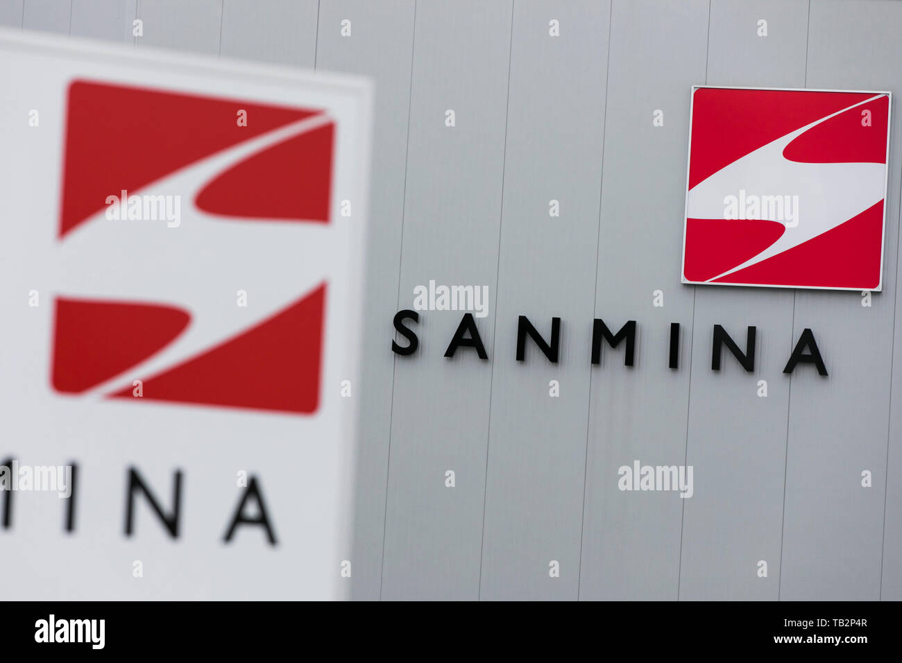 A logo sign outside of a facility occupied by the Sanmina Corporation ...