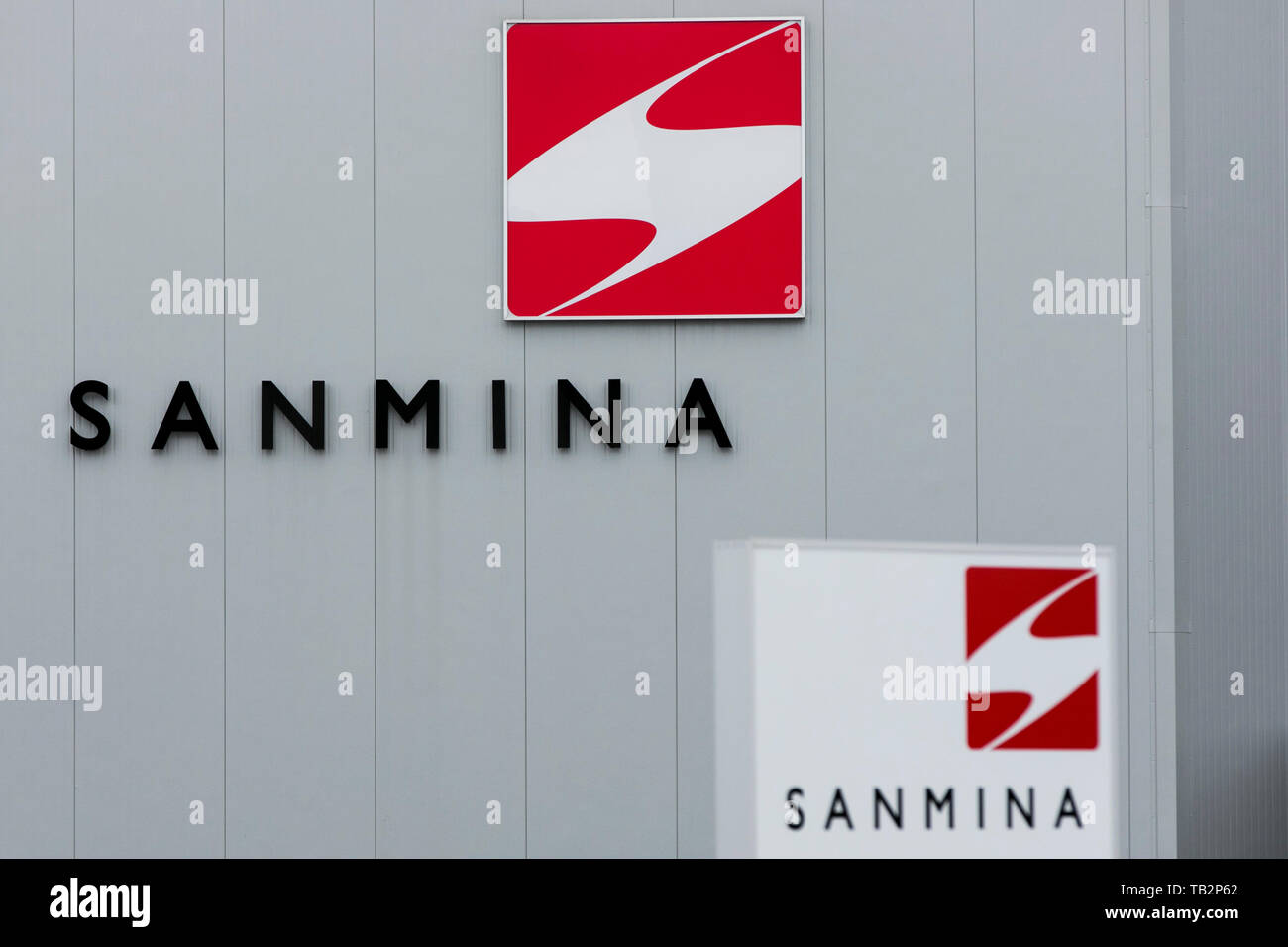 A logo sign outside of a facility occupied by the Sanmina Corporation ...