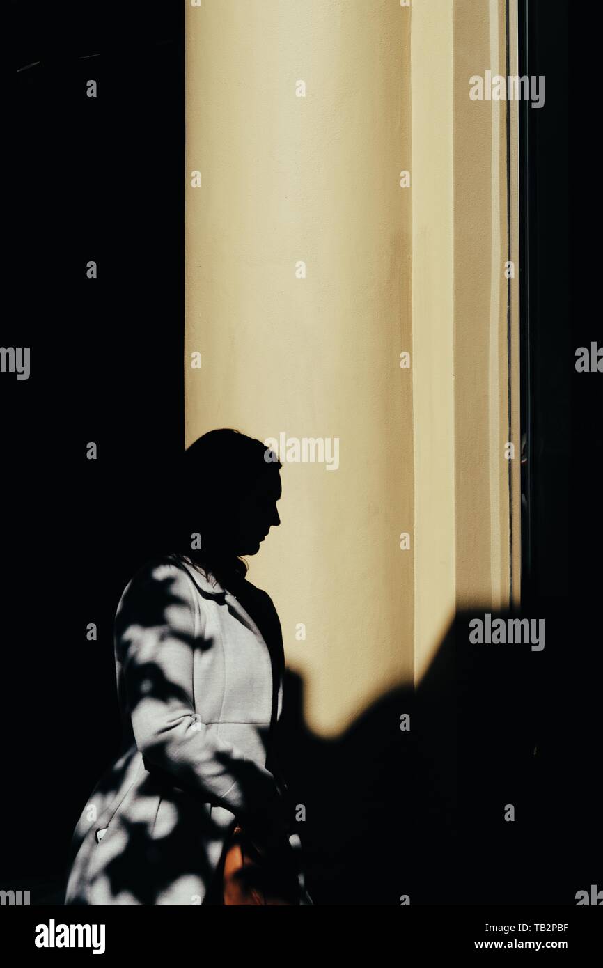 Silhouette of a person standing in the shadows Stock Photo - Alamy