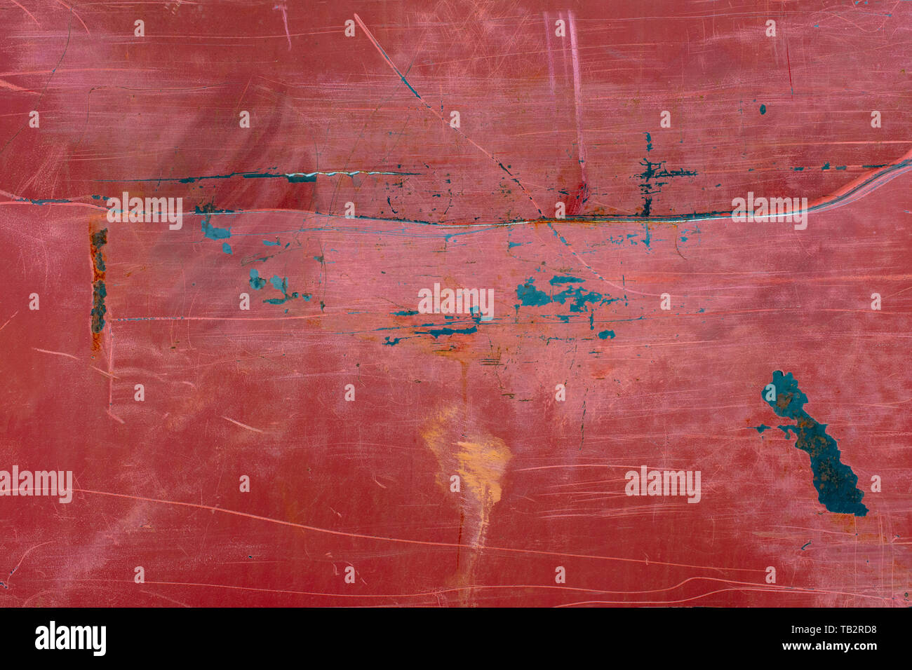 Painted red metal with rust and scratch markings Stock Photo - Alamy