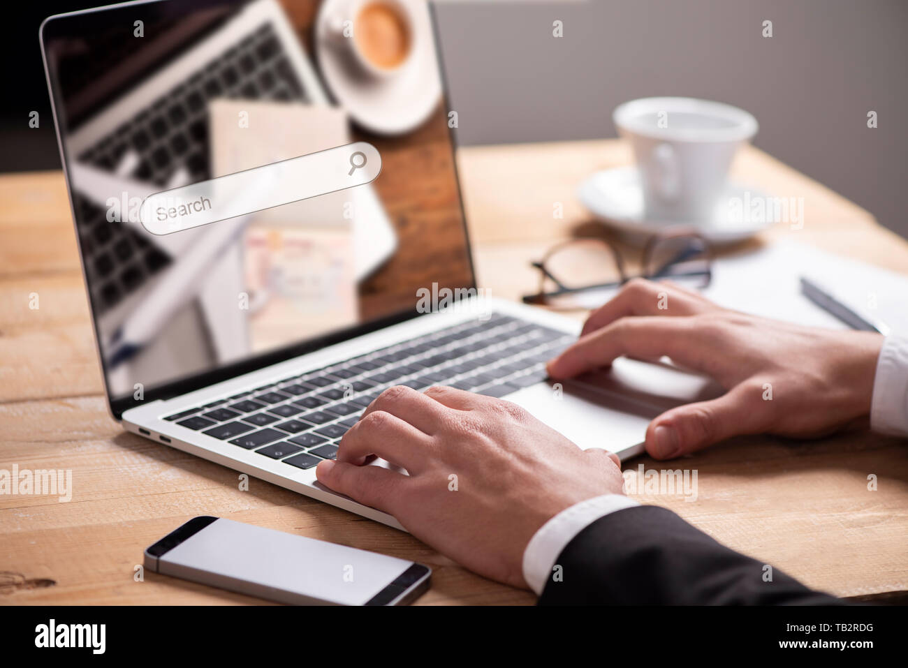 Flight booking concept on a laptop, businessman seraching for a fly on ...