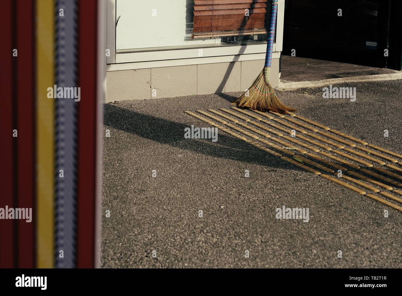Broom on the side of the road Stock Photo - Alamy