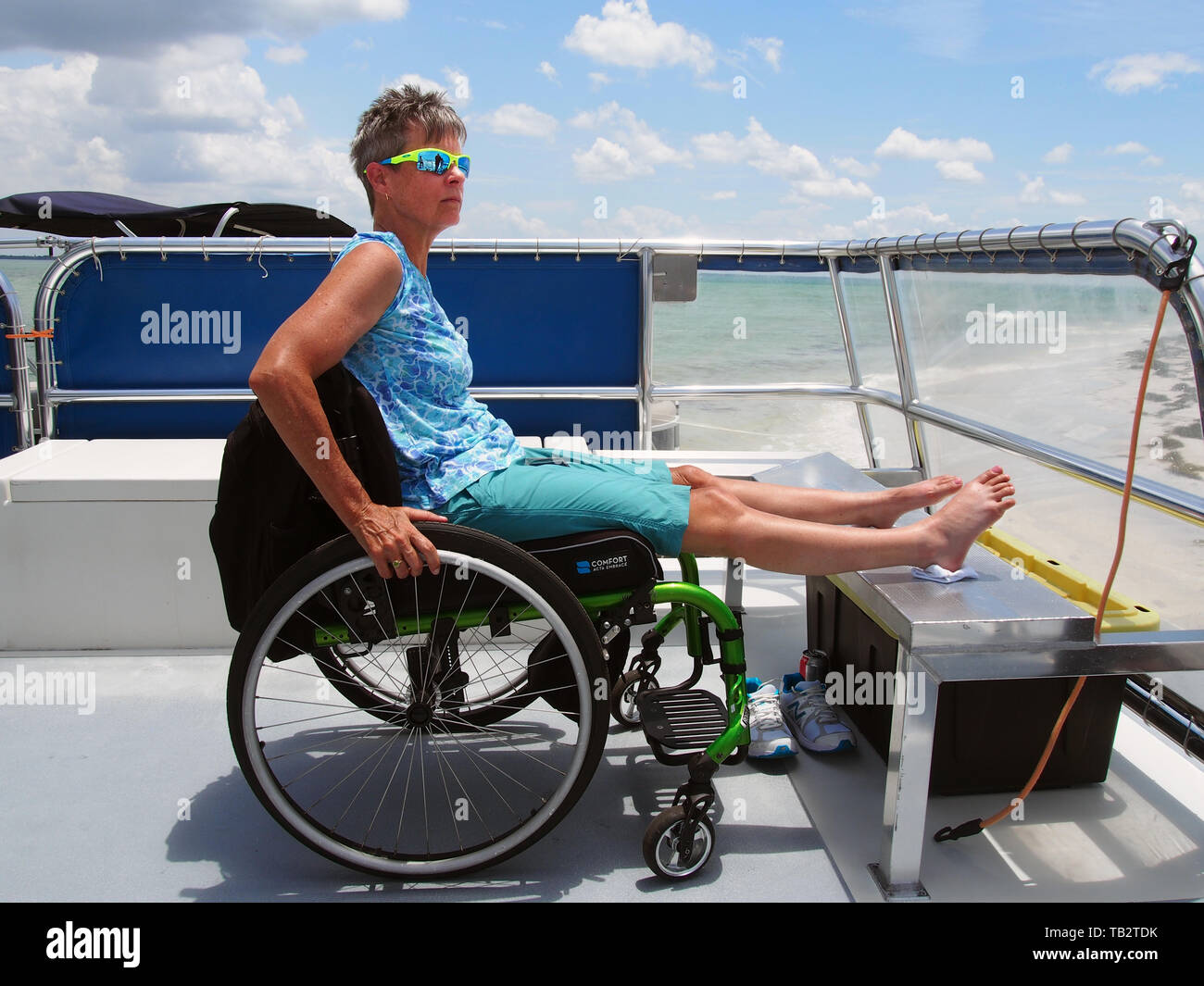 Disabled woman in wheelchair enjoys a boat ride, Florida, USA, May 9 ...
