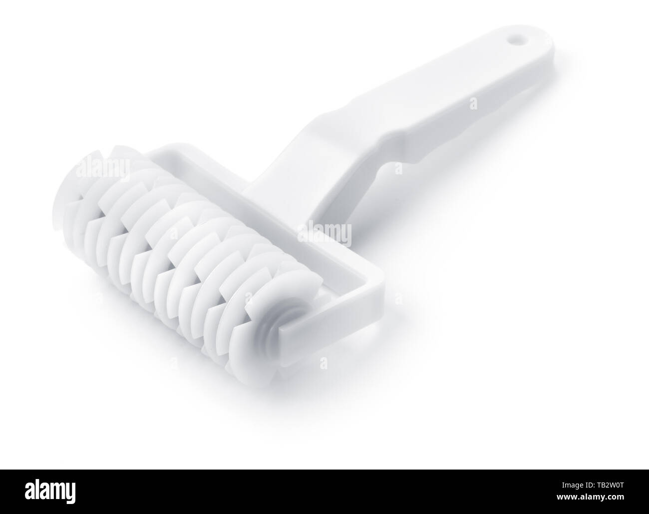 Plastic lattice dough cutter roller isolated on white Stock Photo - Alamy