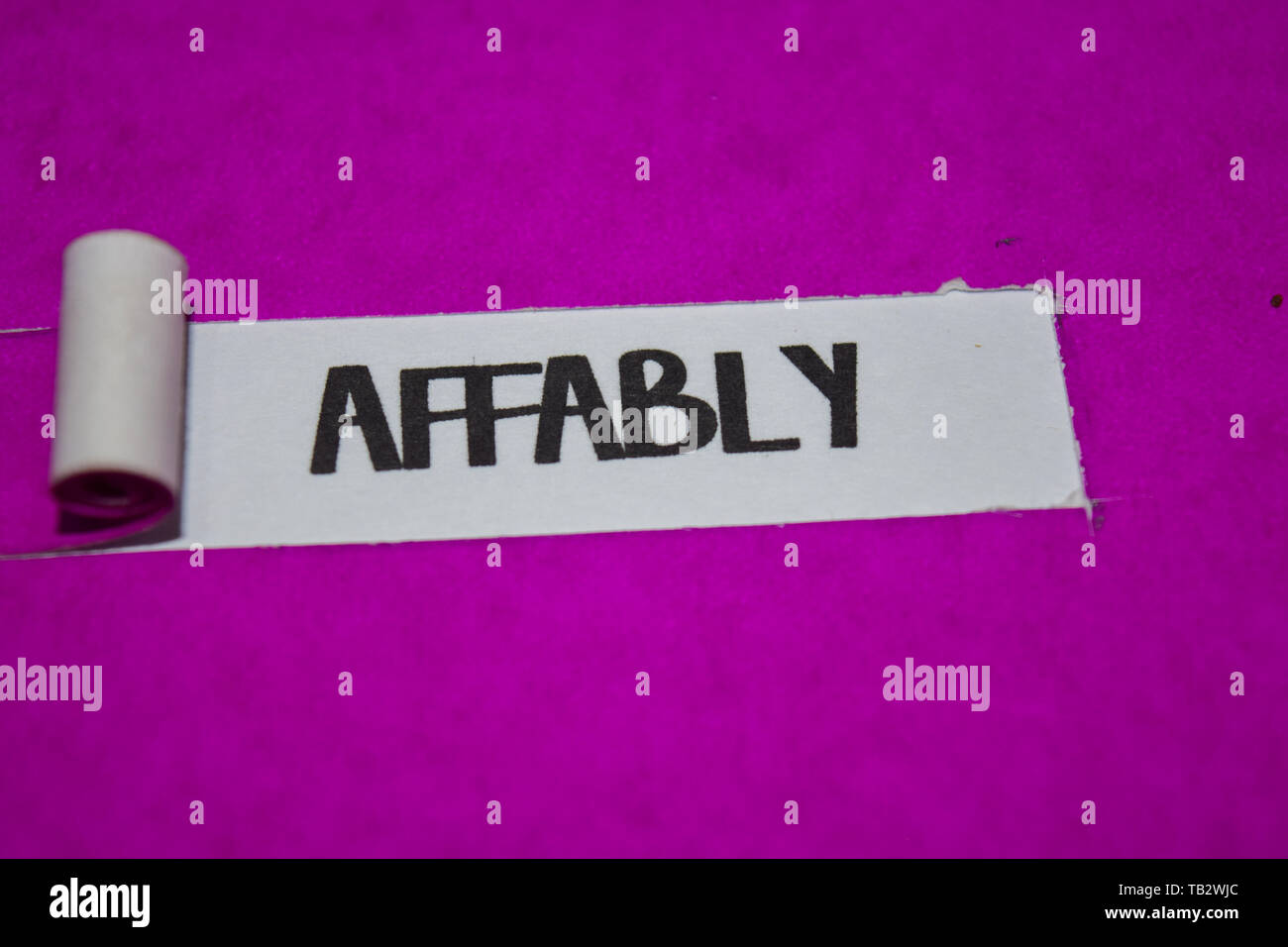 Affably text, Inspiration and positive vibes concept on purple torn ...