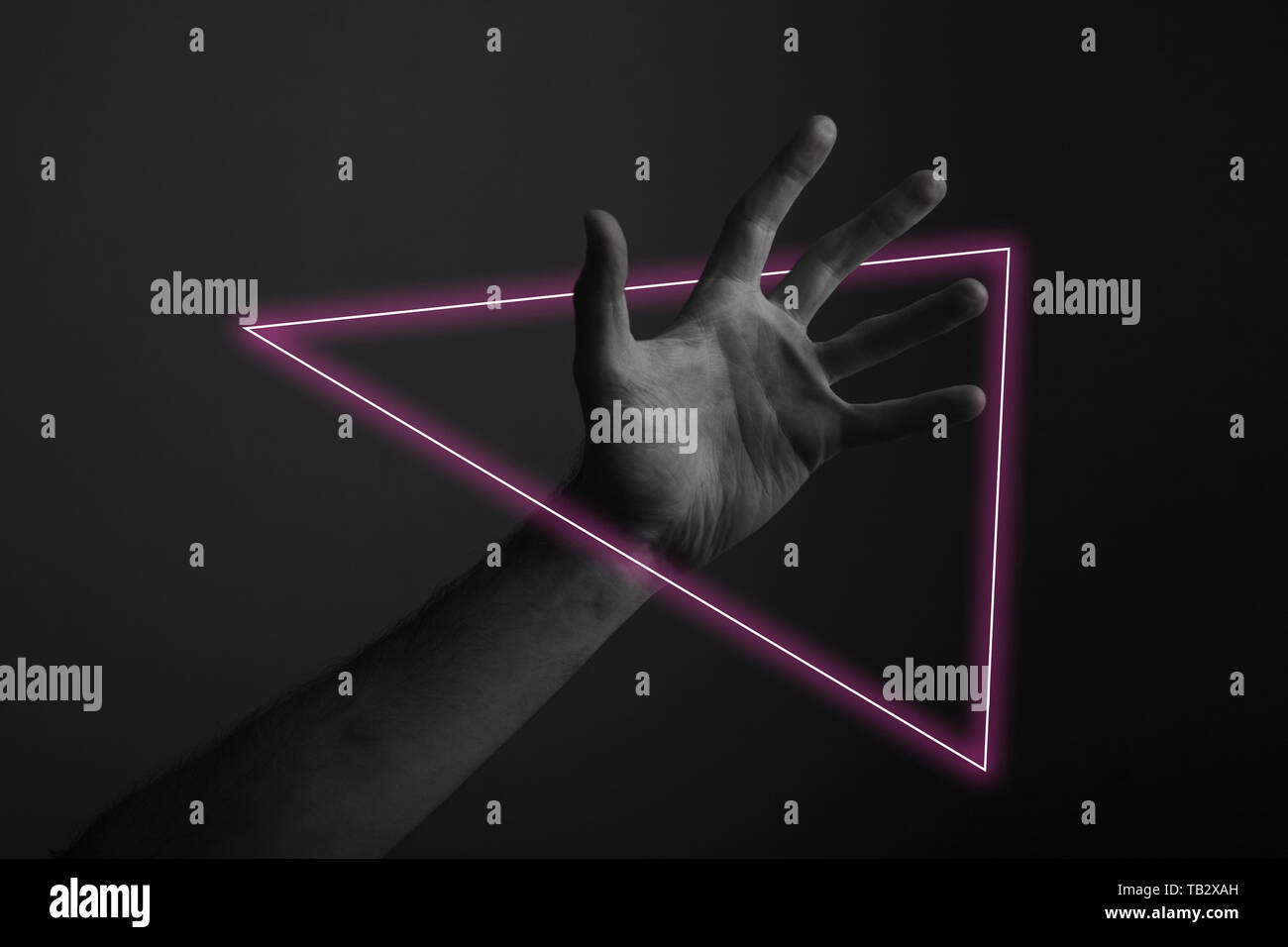 Male open hand gesture on a dark background with abstract neon light ...