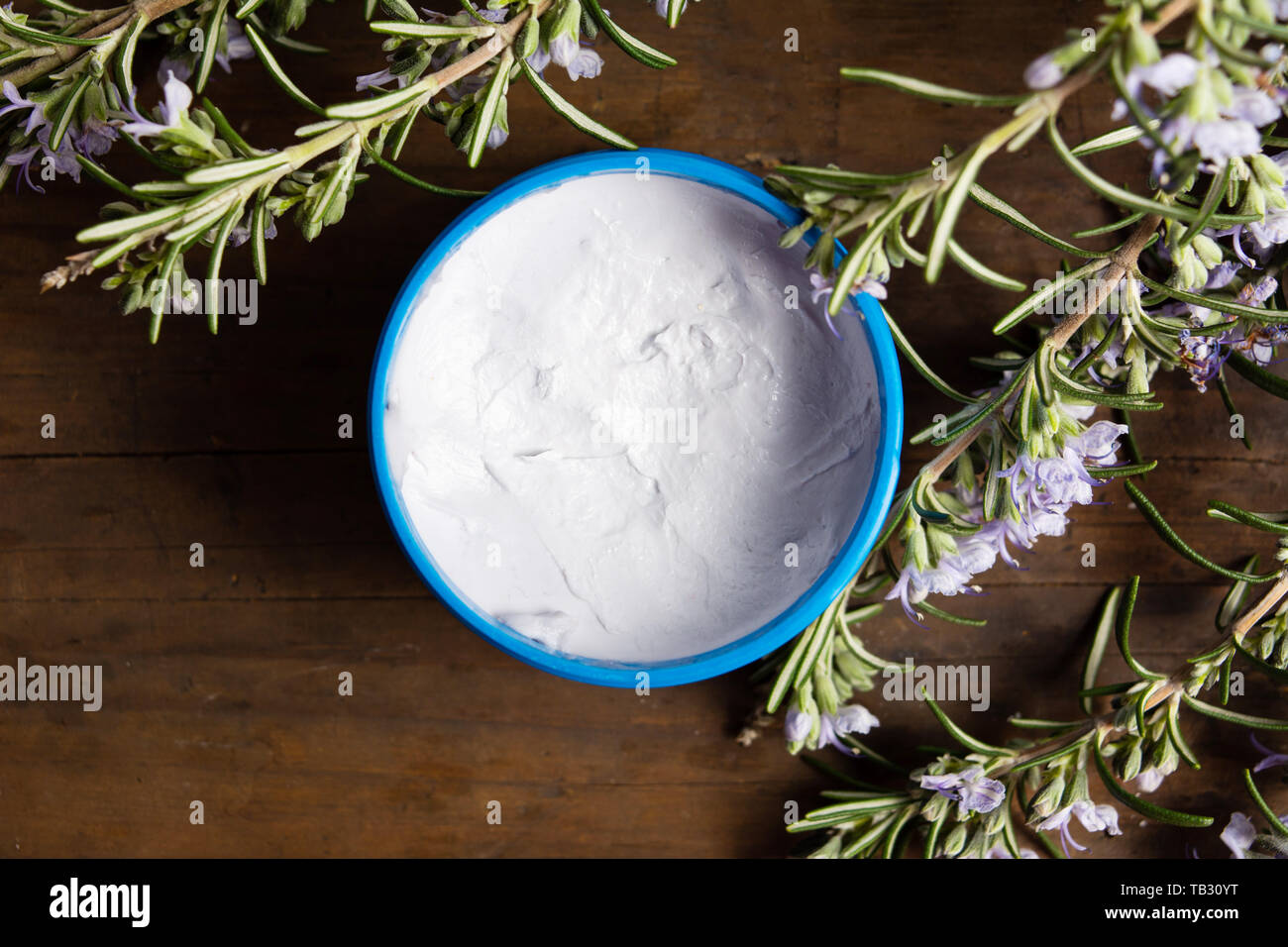 Rosemary cream with flower branches top view Stock Photo - Alamy