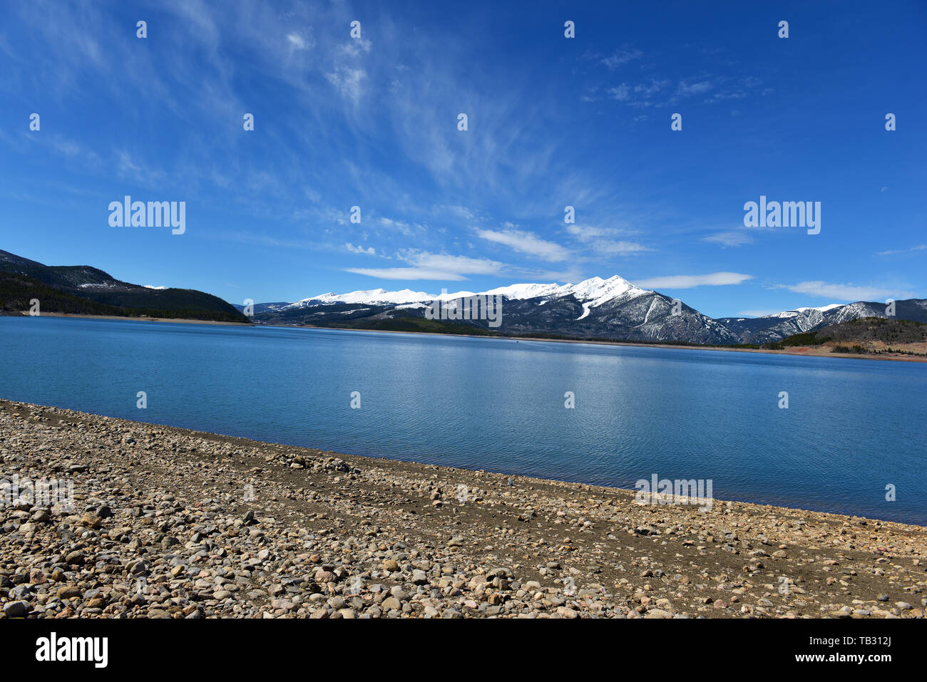 Beautiful high altitude blue alpine lake with snow capped peaks, Rocky ...