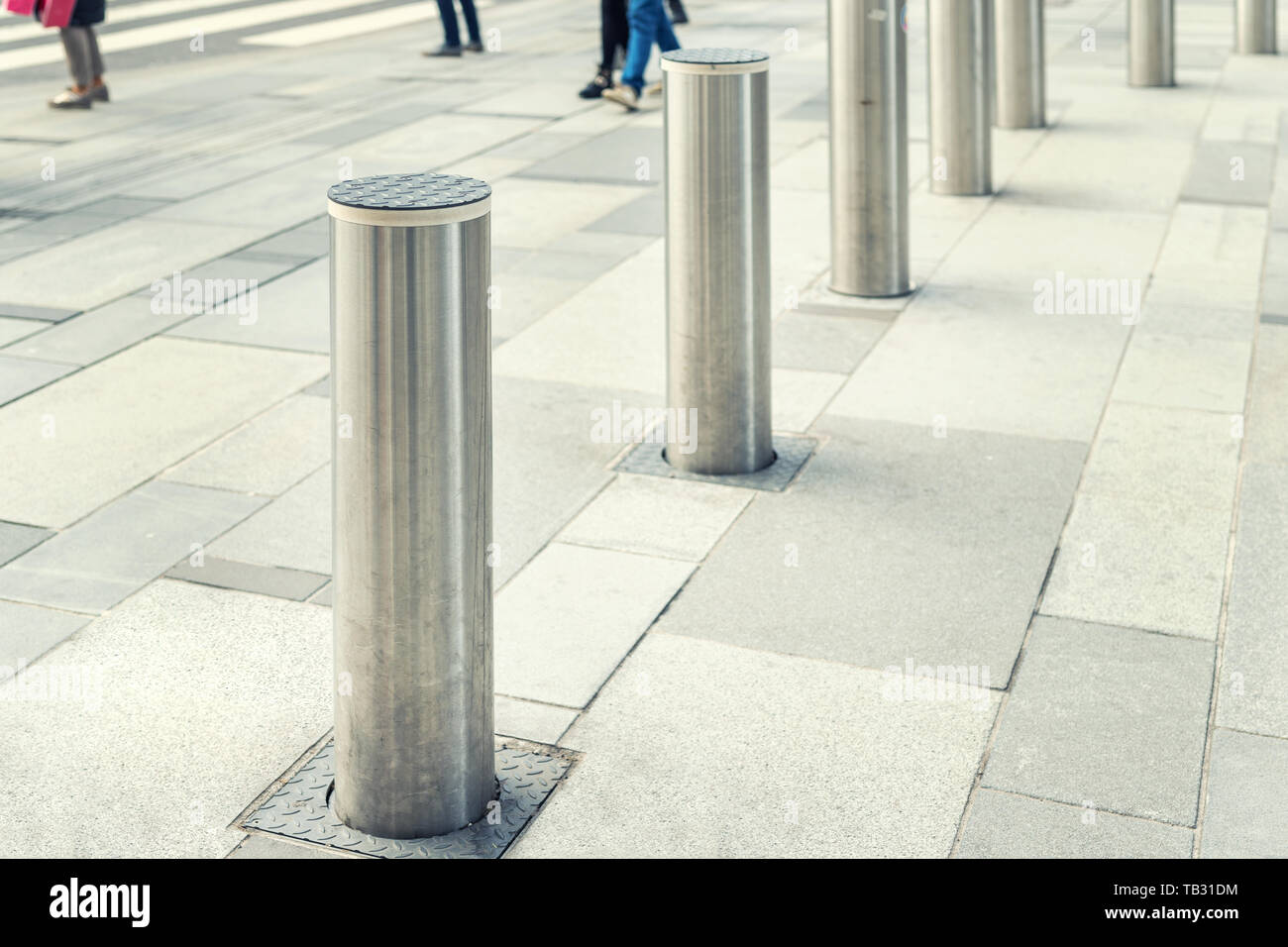 Stainless steel bollard entering pedestrian area on Vienna city street ...