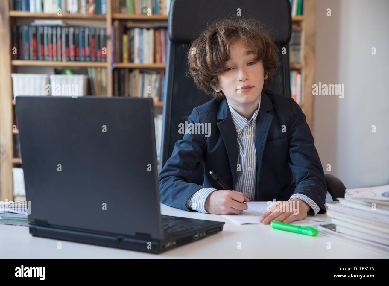 education, childhood and school concept. Boy do his homework Stock ...