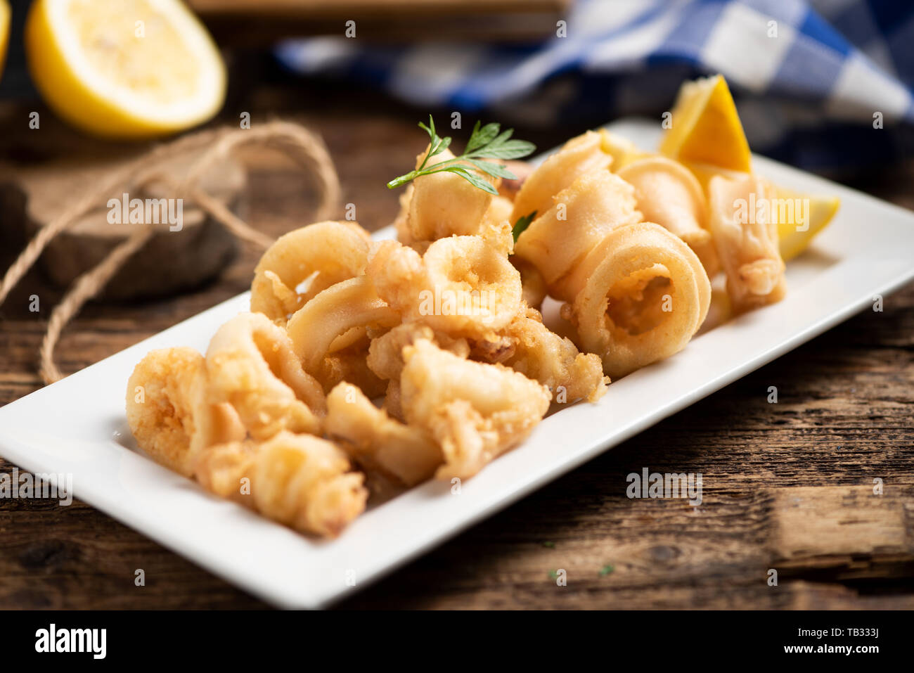 Traditional Italian fried calamari and lemon slice close up Stock Photo ...