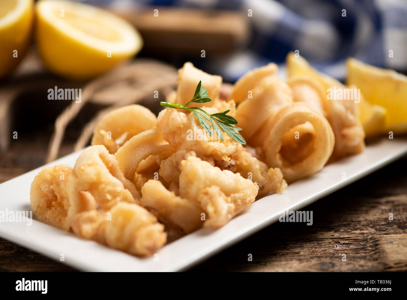 Traditional Italian fried calamari and lemon slice close up Stock Photo ...