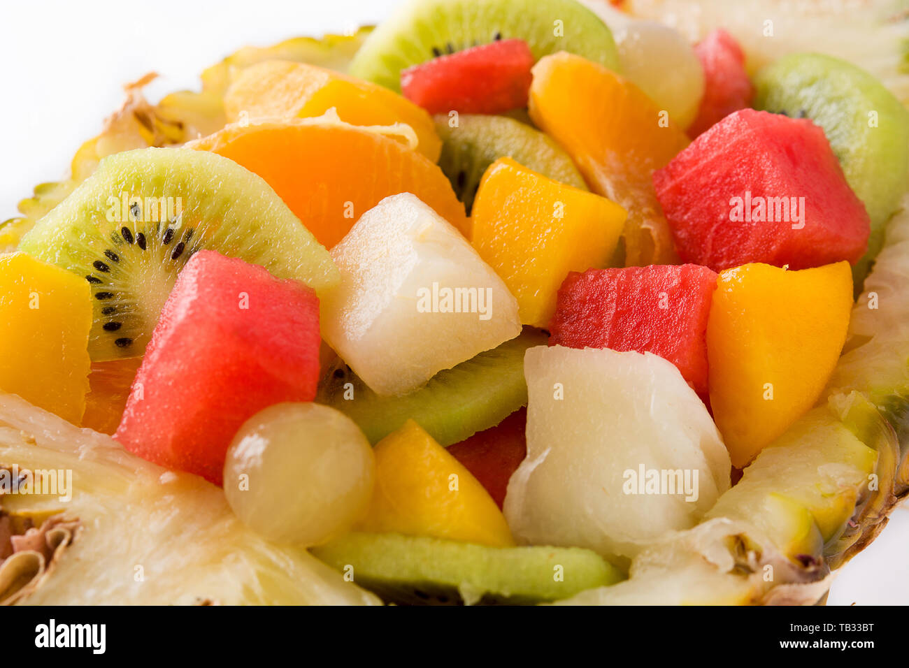 Mix fruit served inside pineapple isolated on white background Stock ...