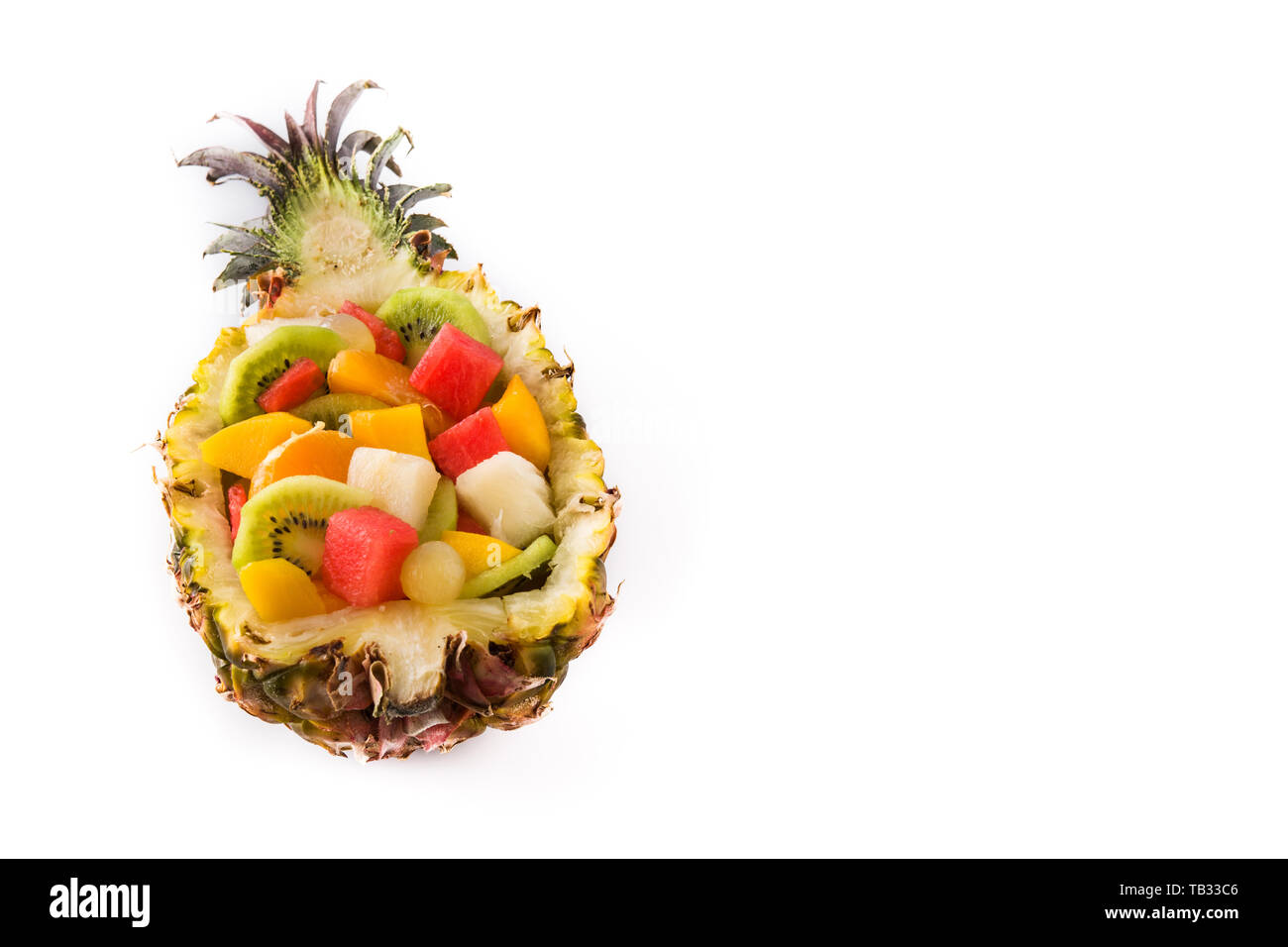 Mix fruit served inside pineapple isolated on white background Stock ...