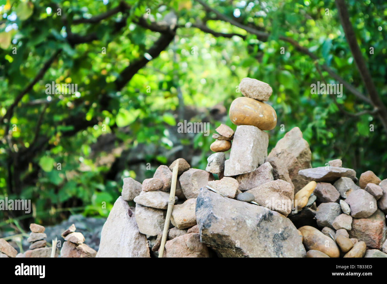 rock is arranged as a pagoda for worship of lord buddha and forest ...