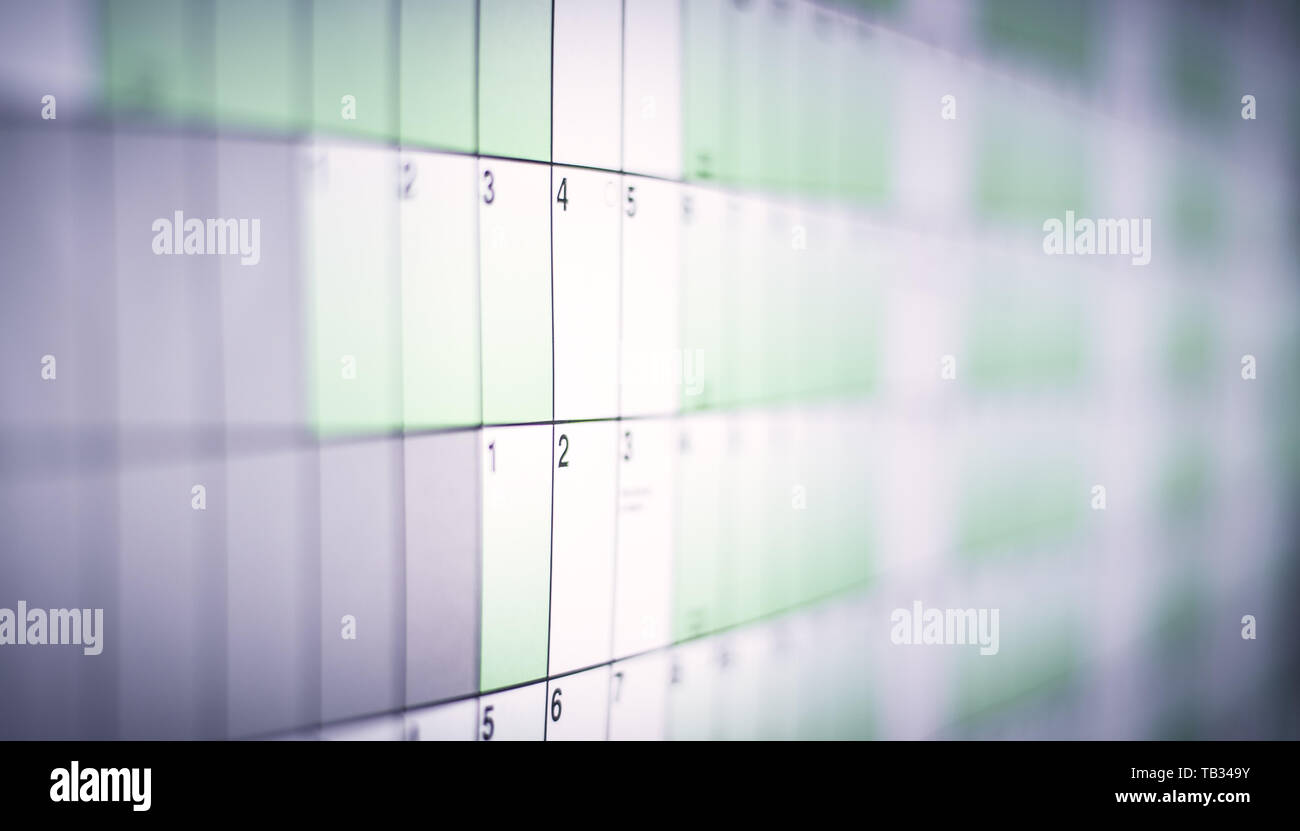 Wall calendar with days and dates isolated from blurred background ...