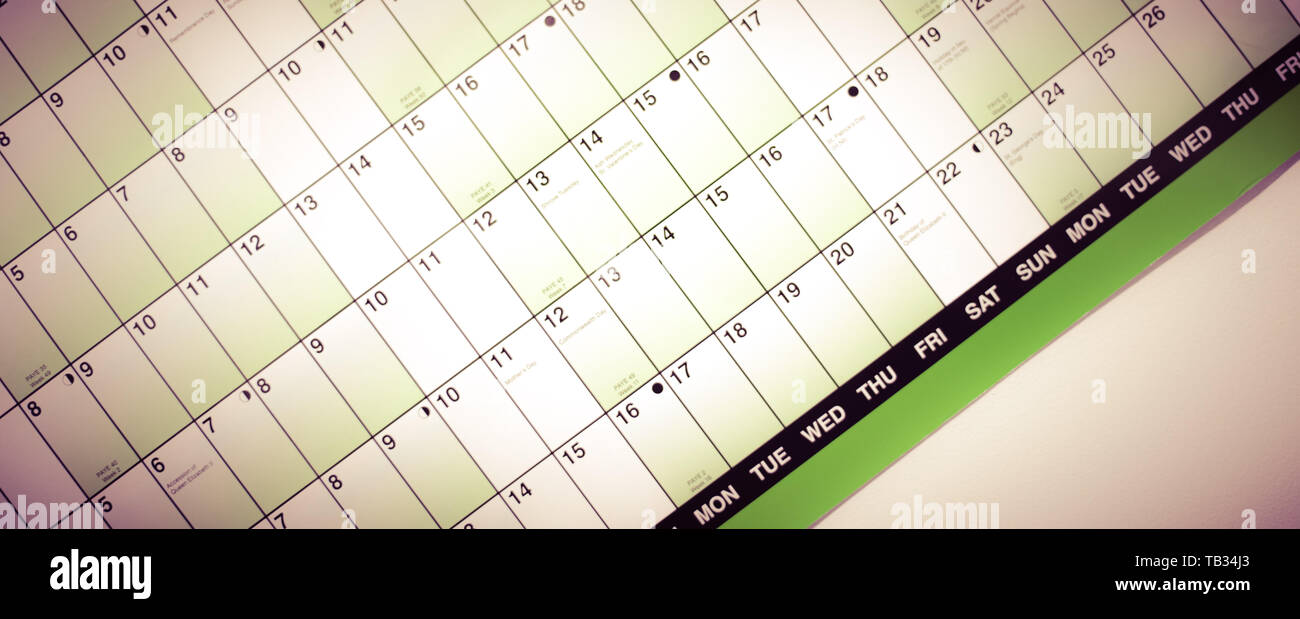 Wall calendar with days and dates isolated from blurred background ...
