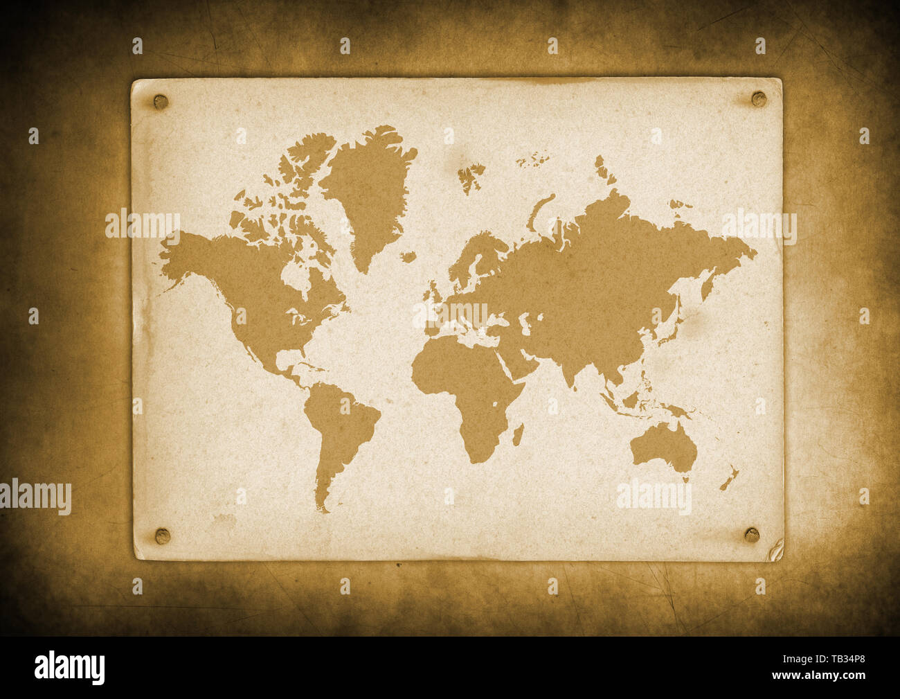 Antique vintage world map parchment nailed to a wall Stock Photo - Alamy