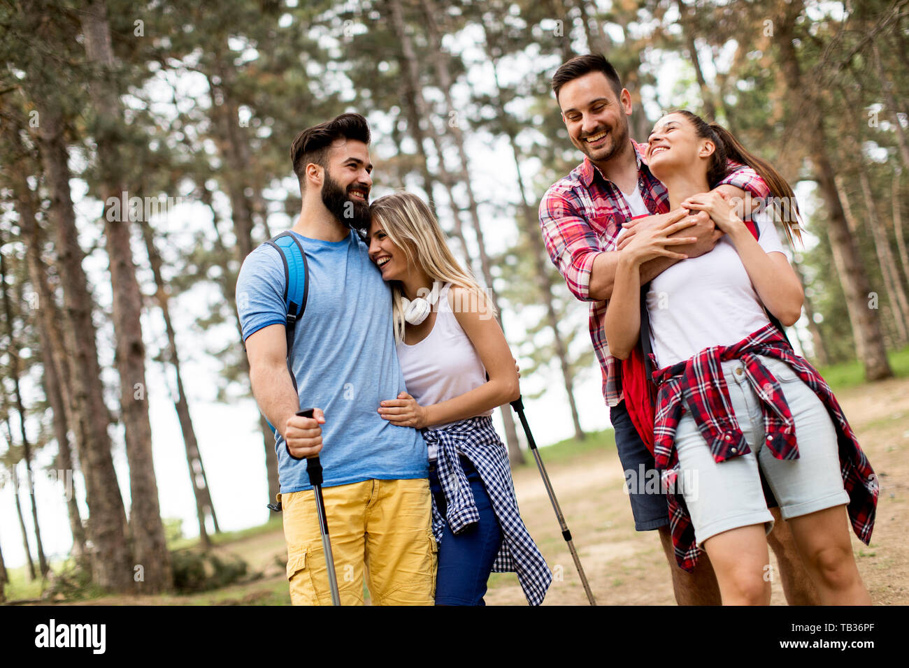 Team four hiking in forest hi-res stock photography and images - Alamy